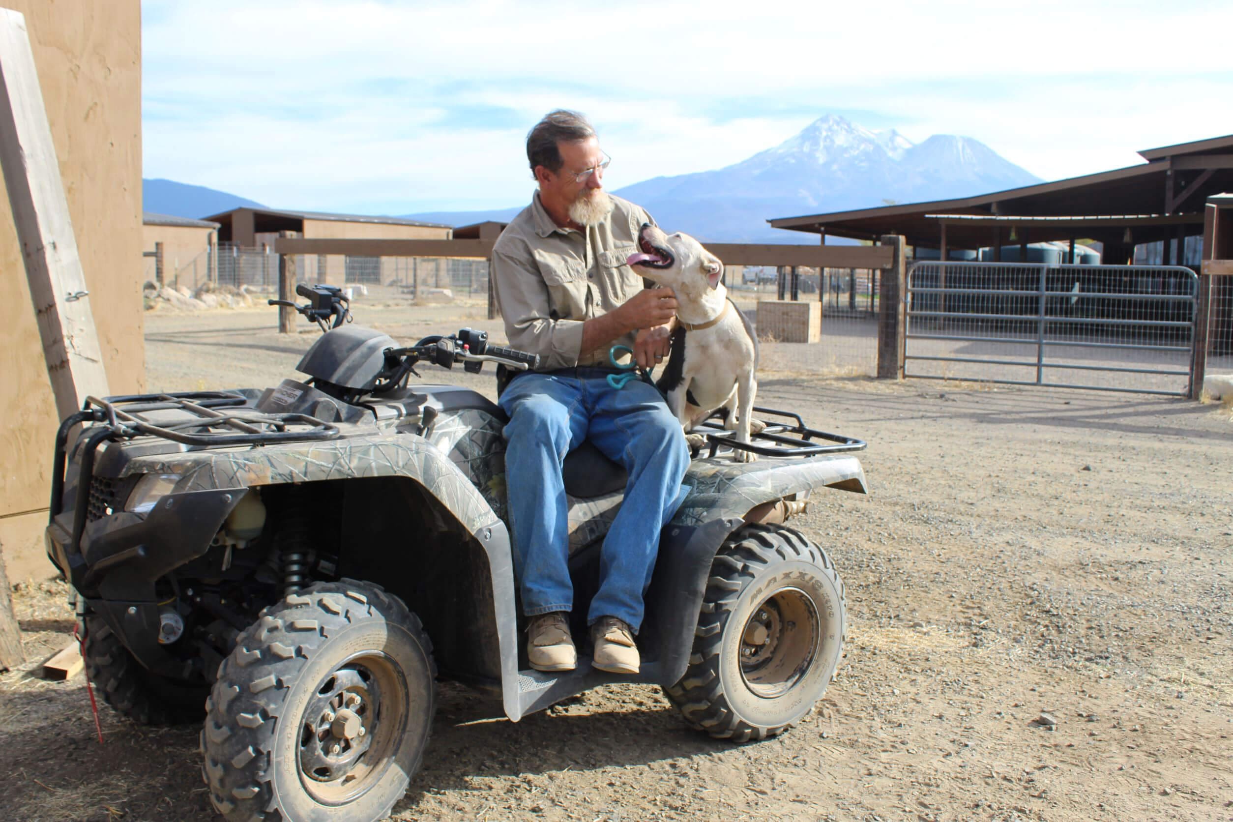 Ramona looking at John on ATV - Rescue Ranch Inc.